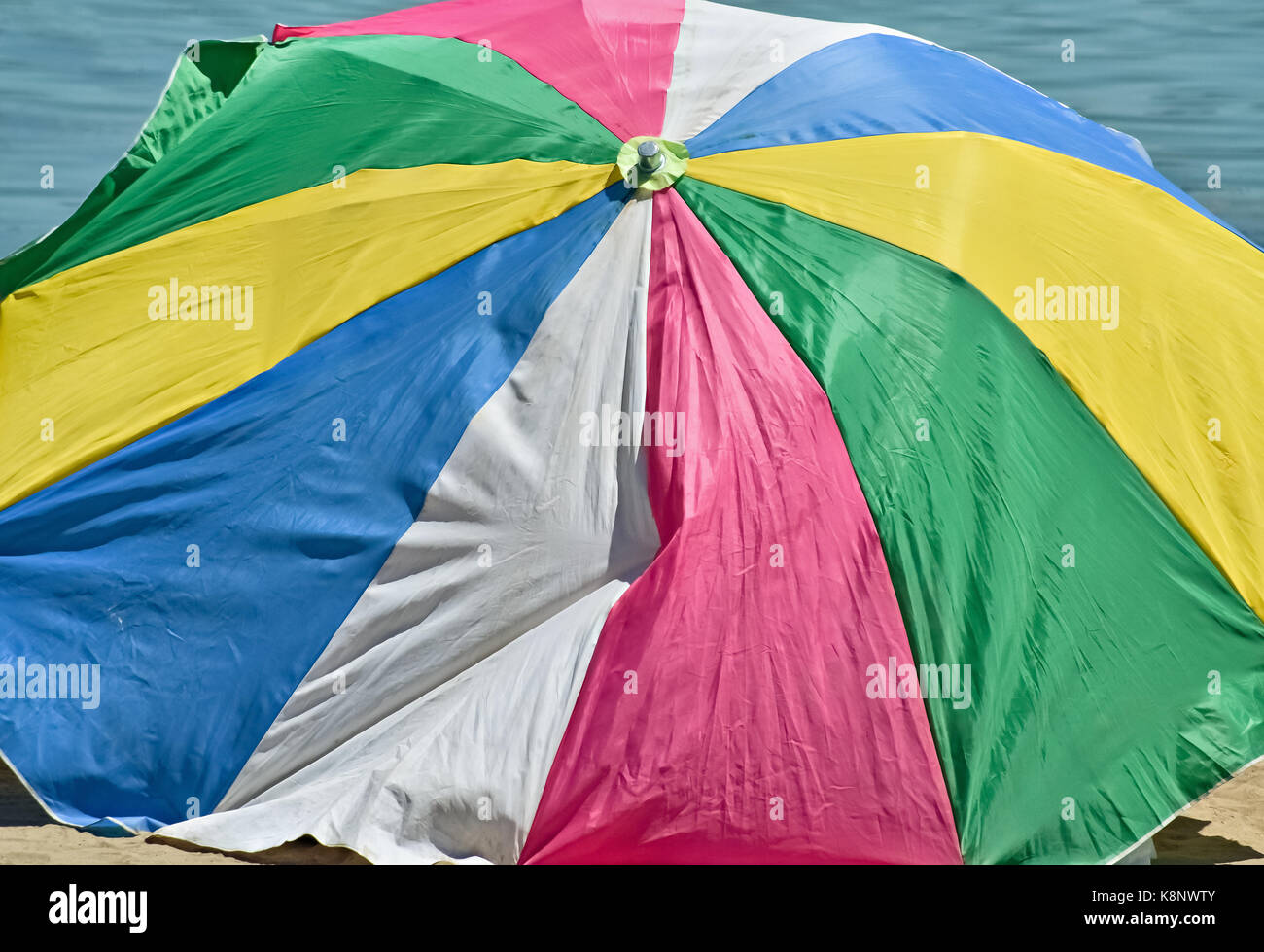 Closeup of a big colorful parasol on the beach Stock Photo - Alamy