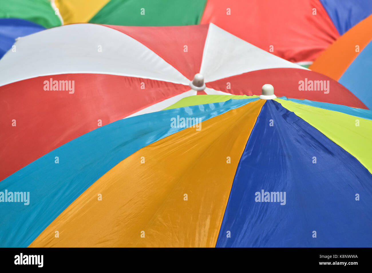 Closeup of a several colorful parasols on the beach Stock Photo - Alamy