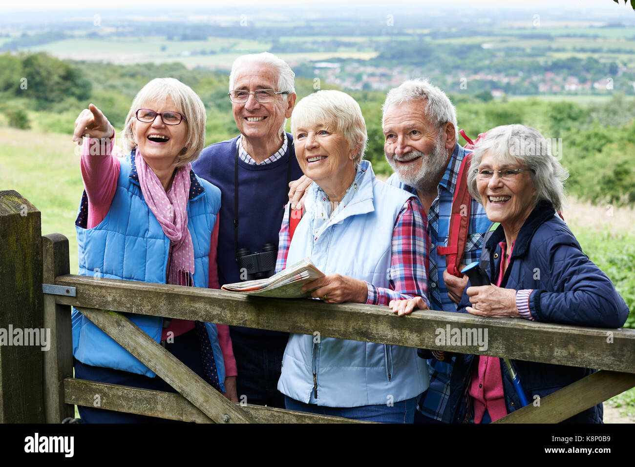 Group Of Senior Friends Hiking In Countryside Stock Photo - Alamy