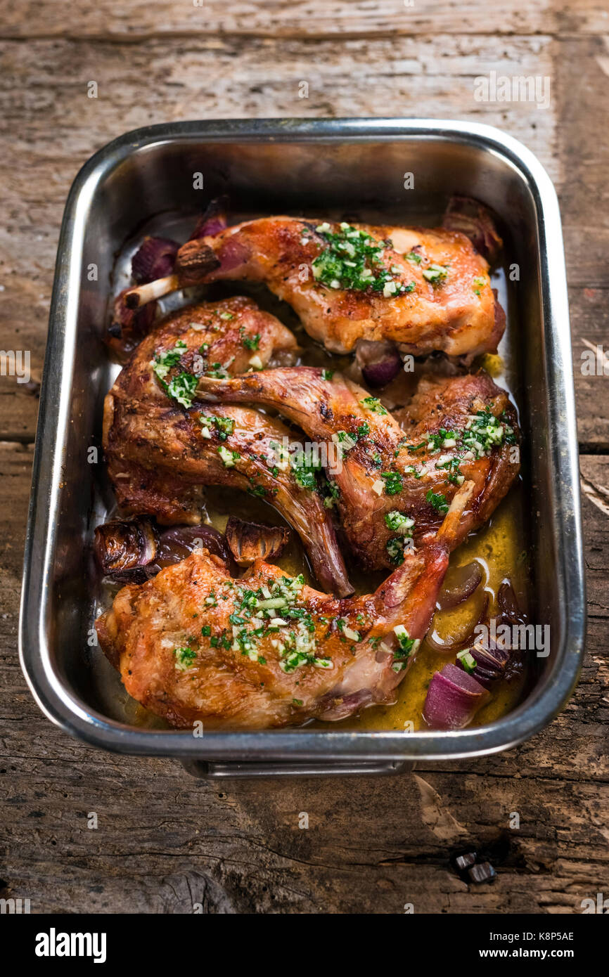 Roasted rabbit leg Stock Photo - Alamy