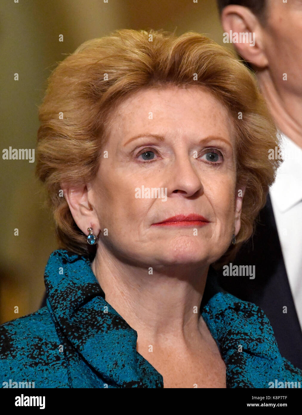 United States Senator Debbie Stabenow (Democrat of Michigan) listens as ...