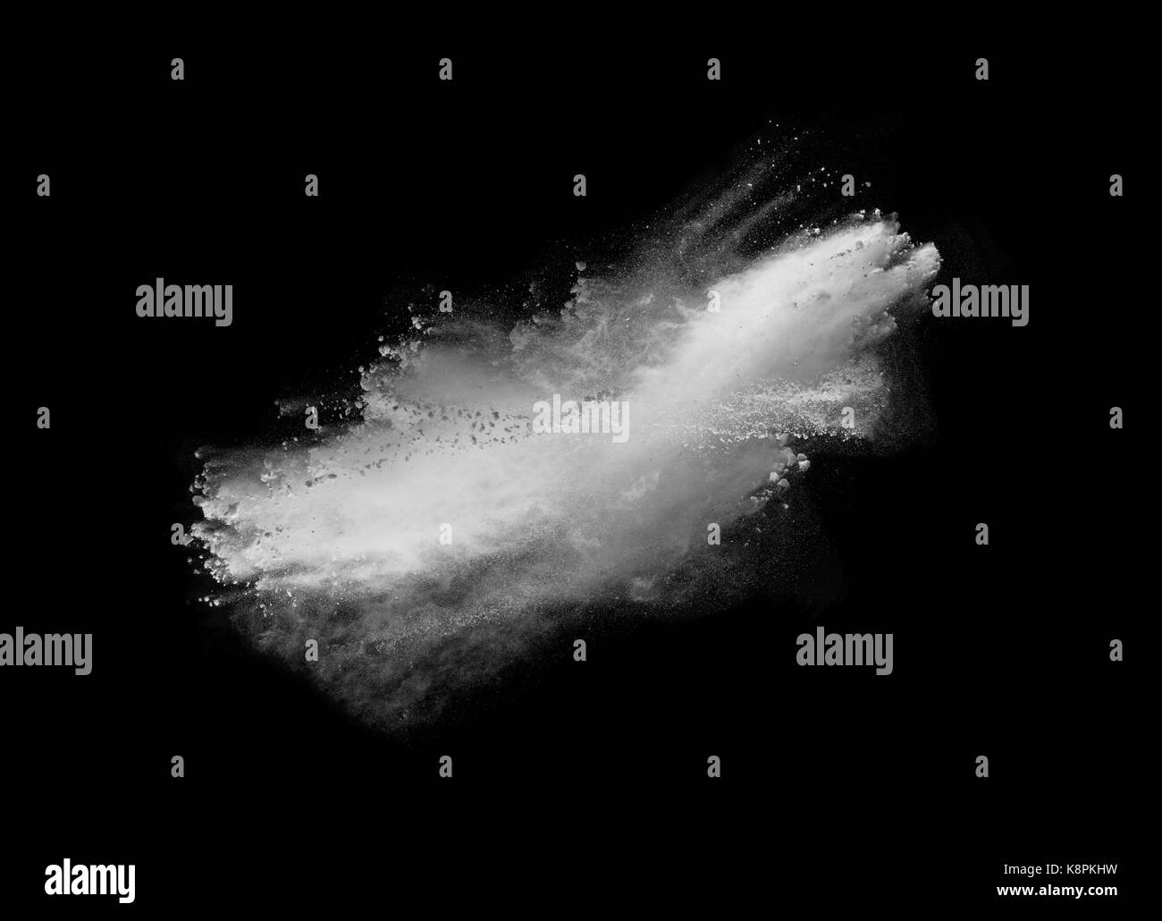 Freeze motion of white dust explosion on black background. Stopping the ...