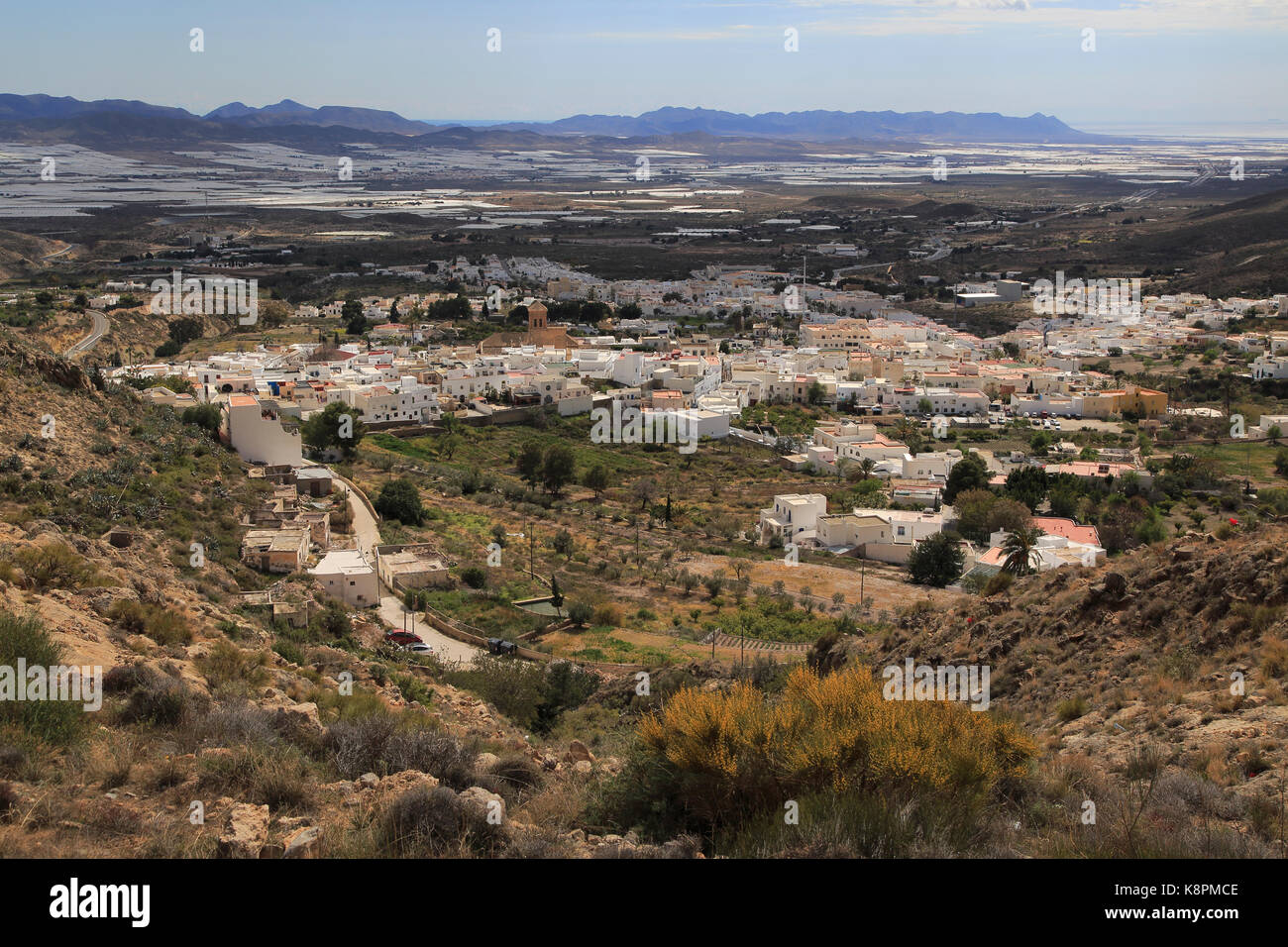 View over village house and plastic farming in the valley from Nijar ...