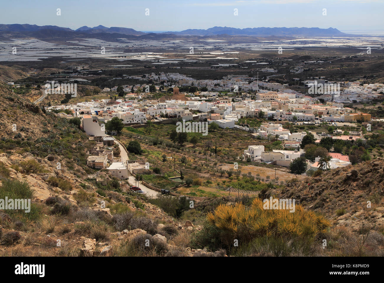View over village house and plastic farming in the valley from Nijar ...