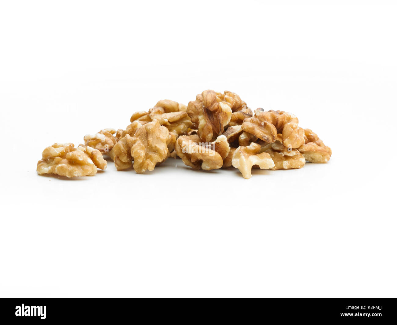 A pile of shelled Walnuts on a white background Stock Photo - Alamy