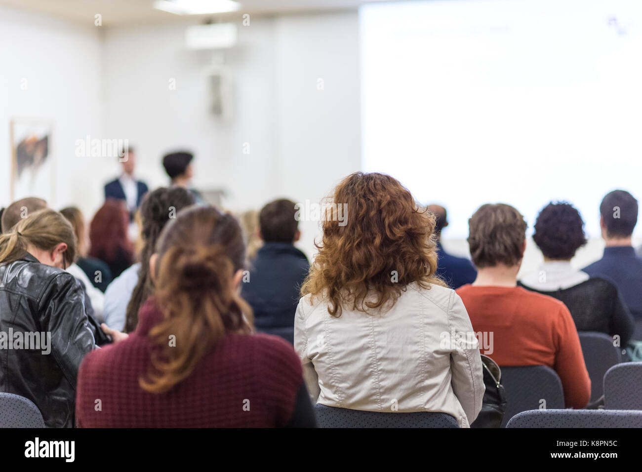 Woman giving presentation on business conference Stock Photo - Alamy