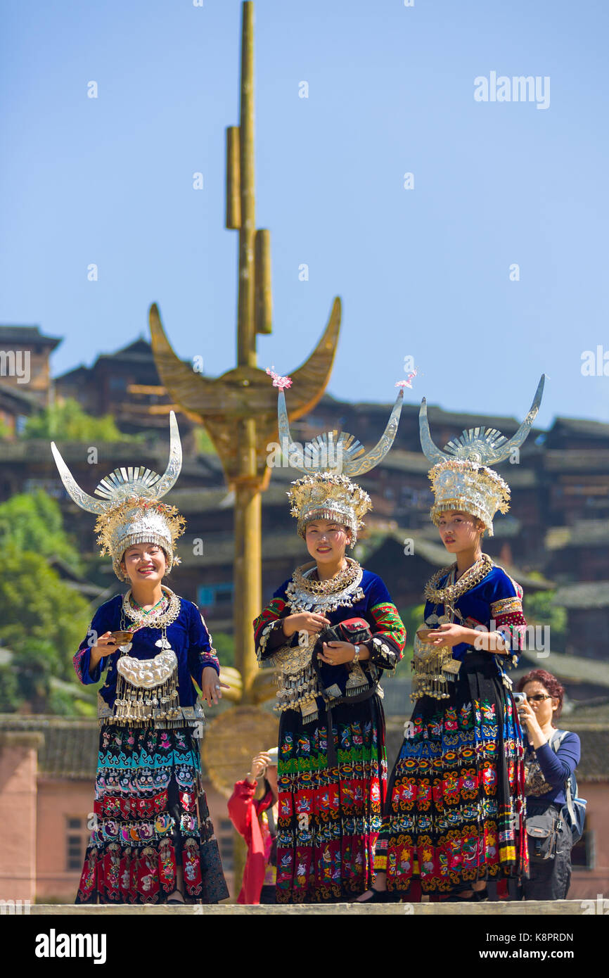Xijiang, China - September 15, 2007: Three Miao women wearing full ...
