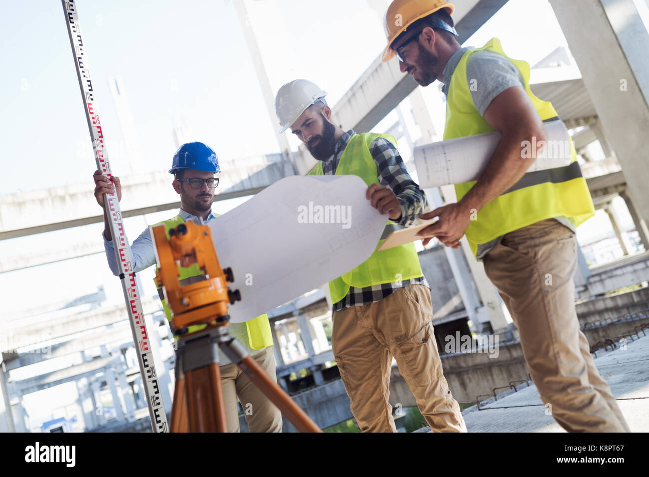 Portrait of construction engineers working on building site Stock Photo ...