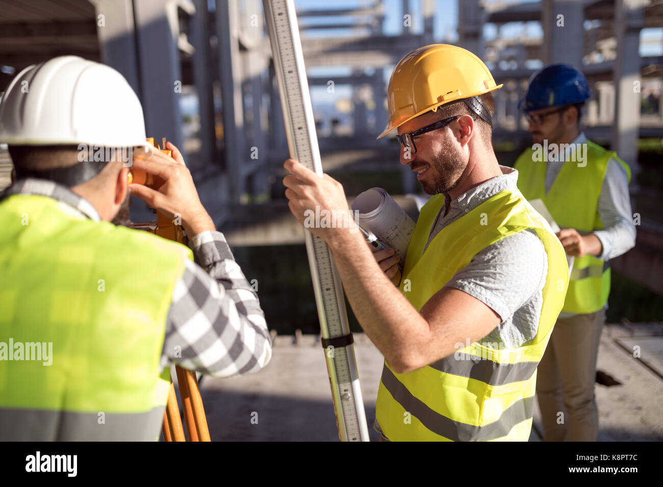 Portrait of construction engineers working on building site Stock Photo ...