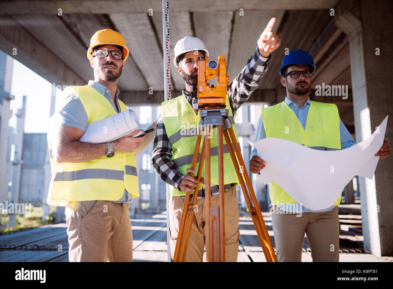 Portrait of construction engineers working on building site Stock Photo ...