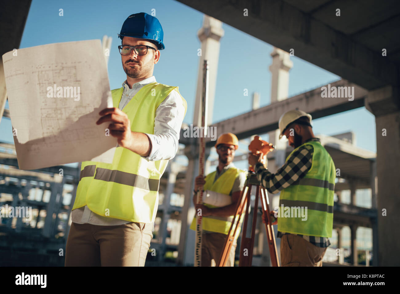Portrait of construction engineers working on building site Stock Photo ...
