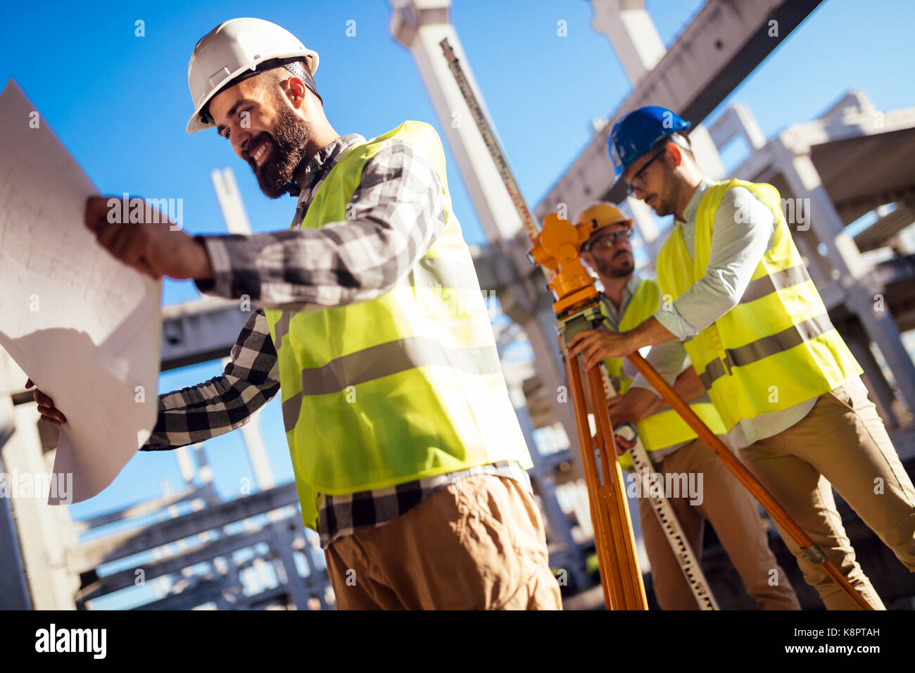Portrait of construction engineers working on building site Stock Photo ...
