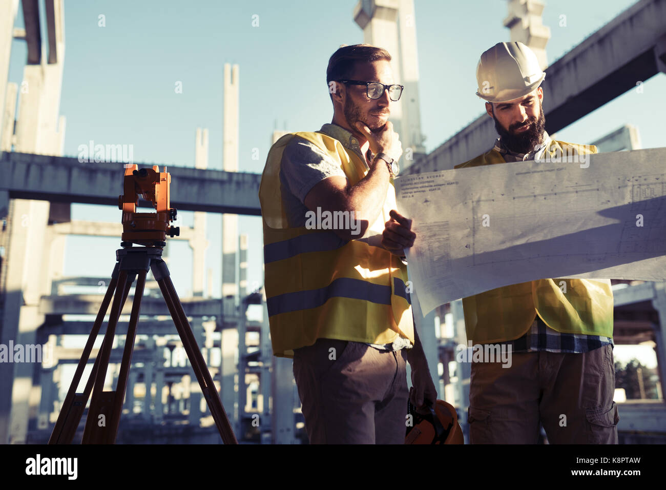 Portrait of construction engineers working on building site Stock Photo ...