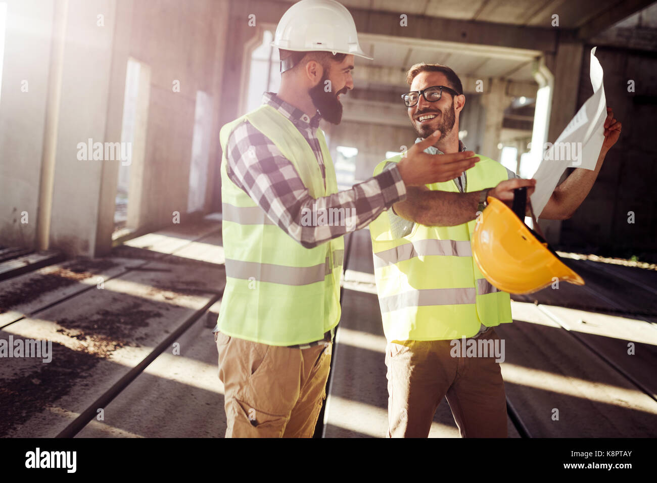 Portrait of construction engineers working on building site Stock Photo ...