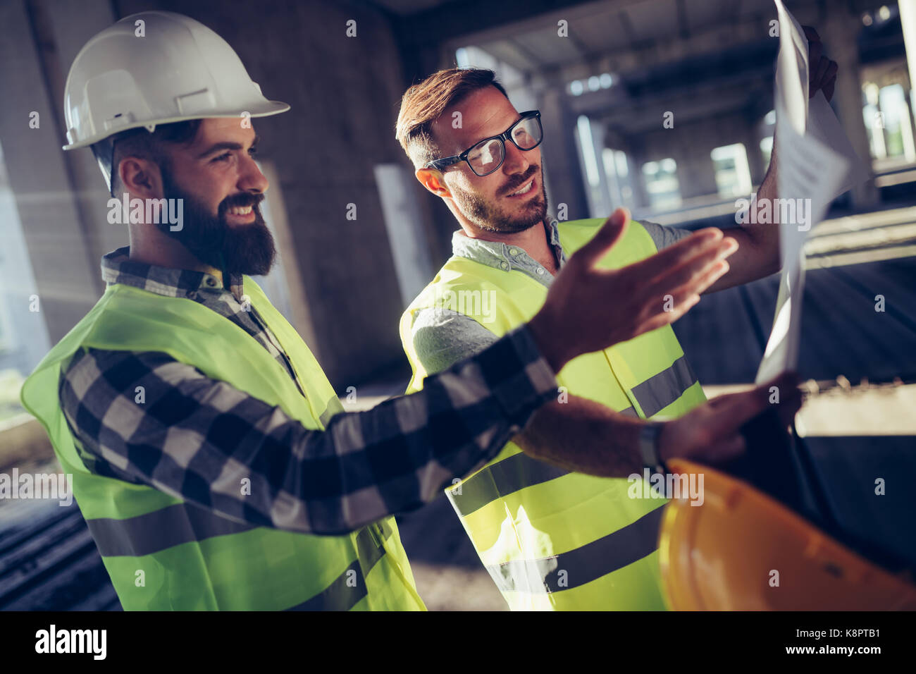Portrait of construction engineers working on building site Stock Photo ...