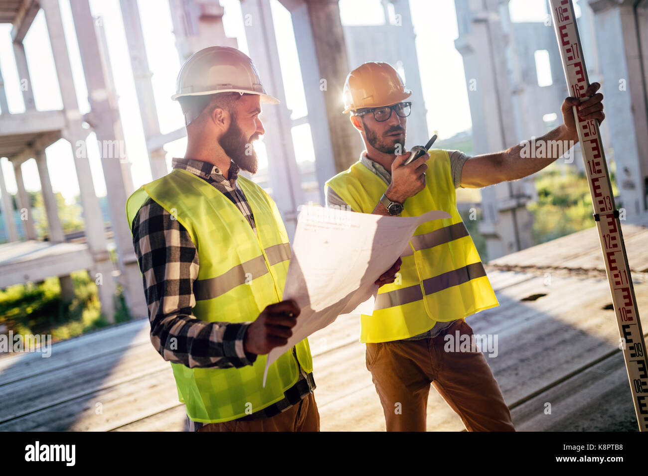 Portrait of construction engineers working on building site Stock Photo ...