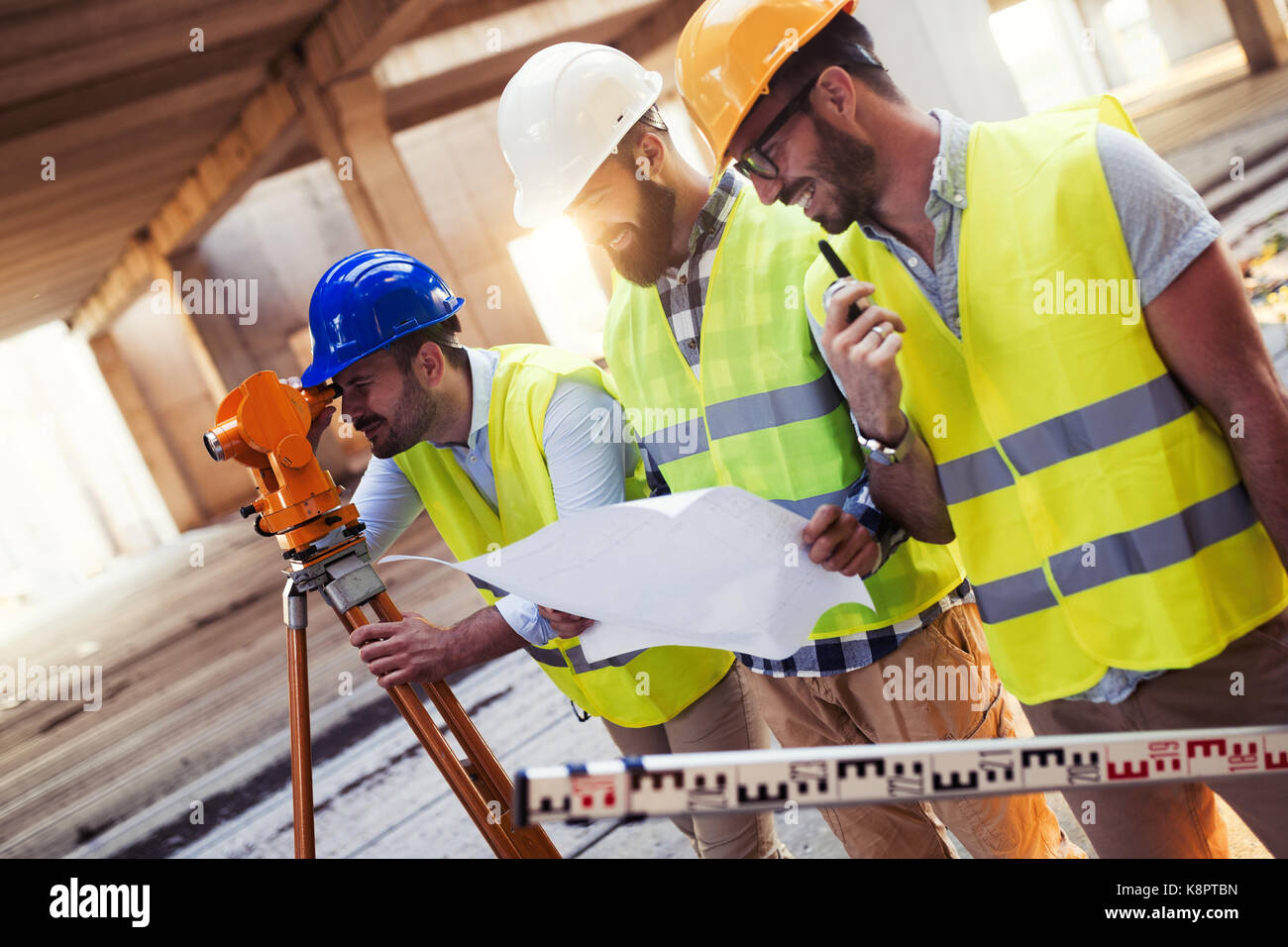 Portrait of construction engineers working on building site Stock Photo ...