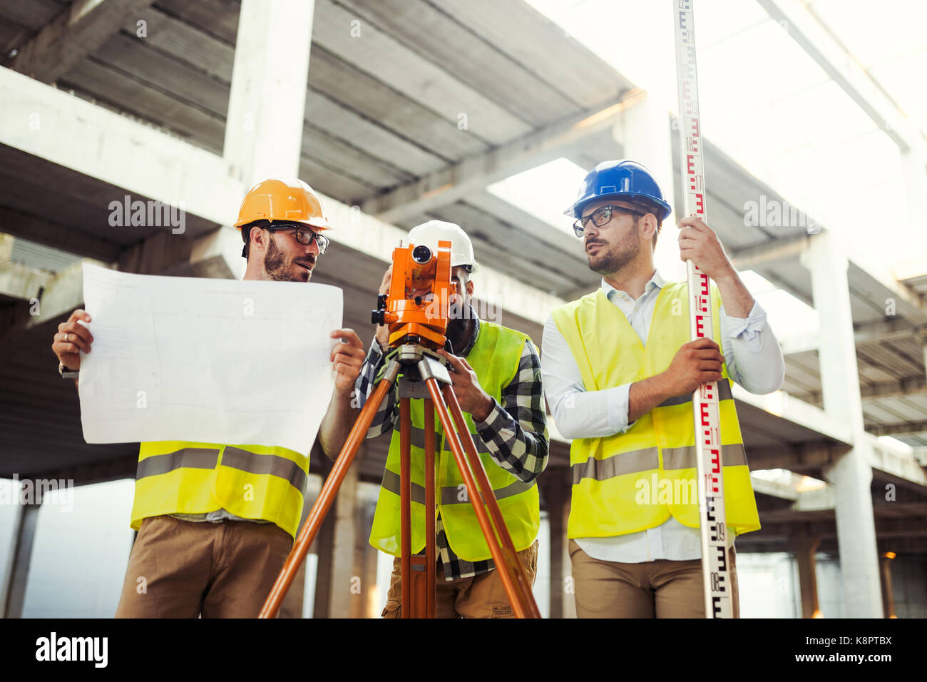 Portrait of construction engineers working on building site Stock Photo ...