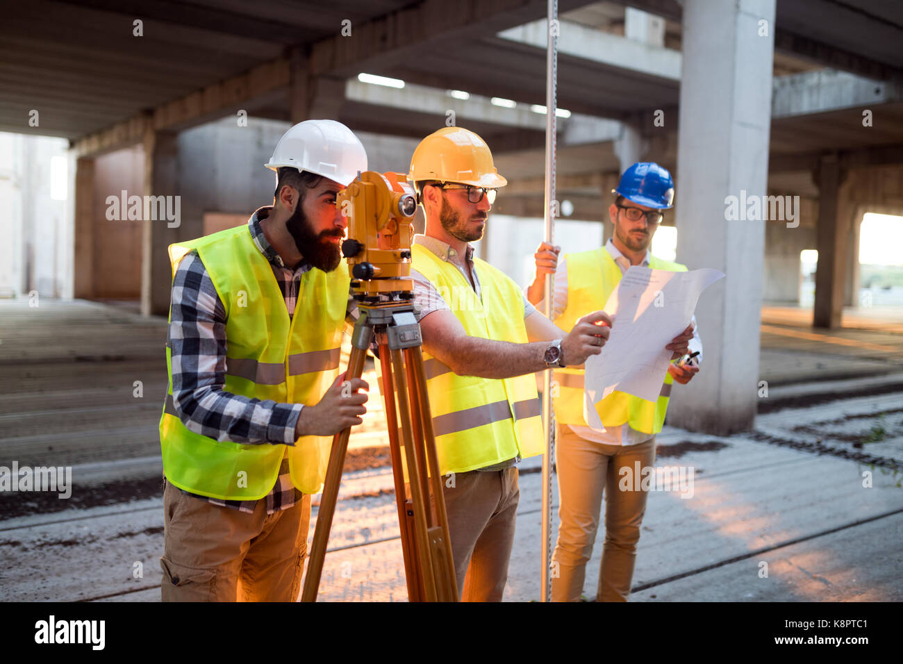 Portrait of construction engineers working on building site Stock Photo ...
