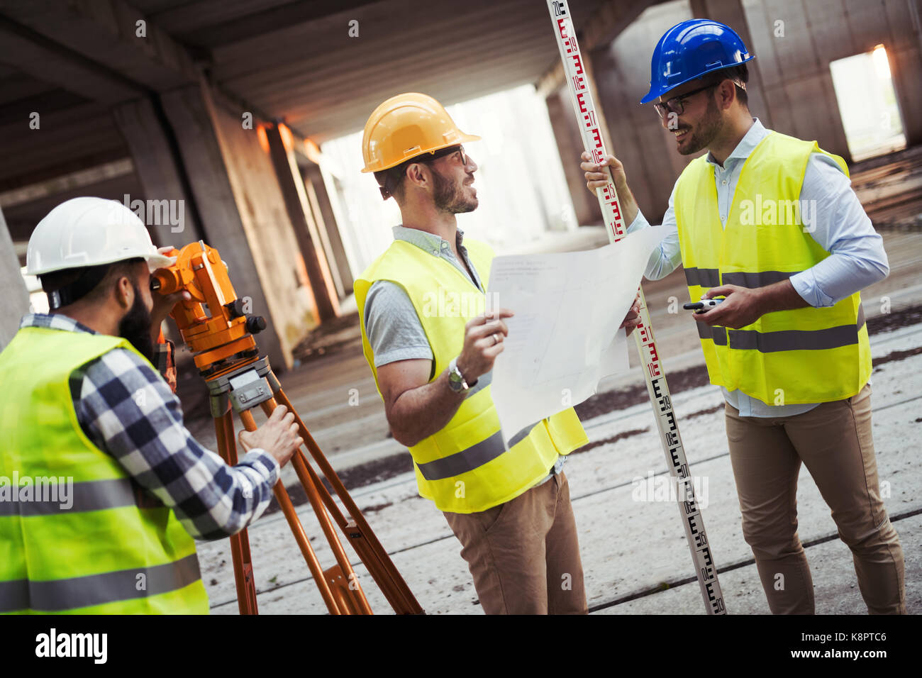 Portrait of construction engineers working on building site Stock Photo ...