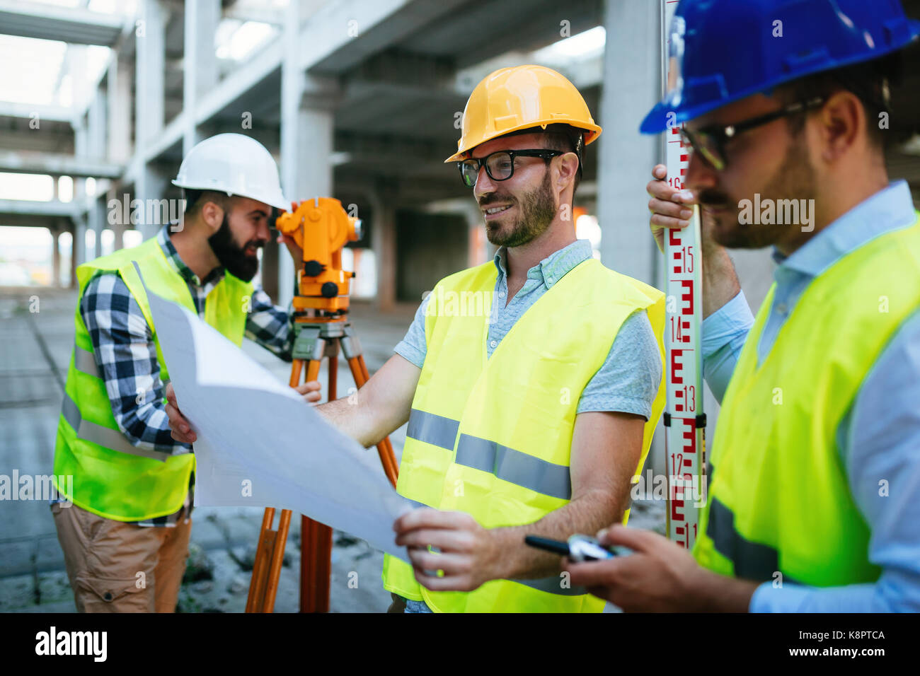 Portrait of construction engineers working on building site Stock Photo ...