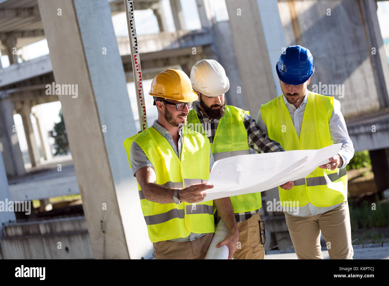 Portrait of construction engineers working on building site Stock Photo ...