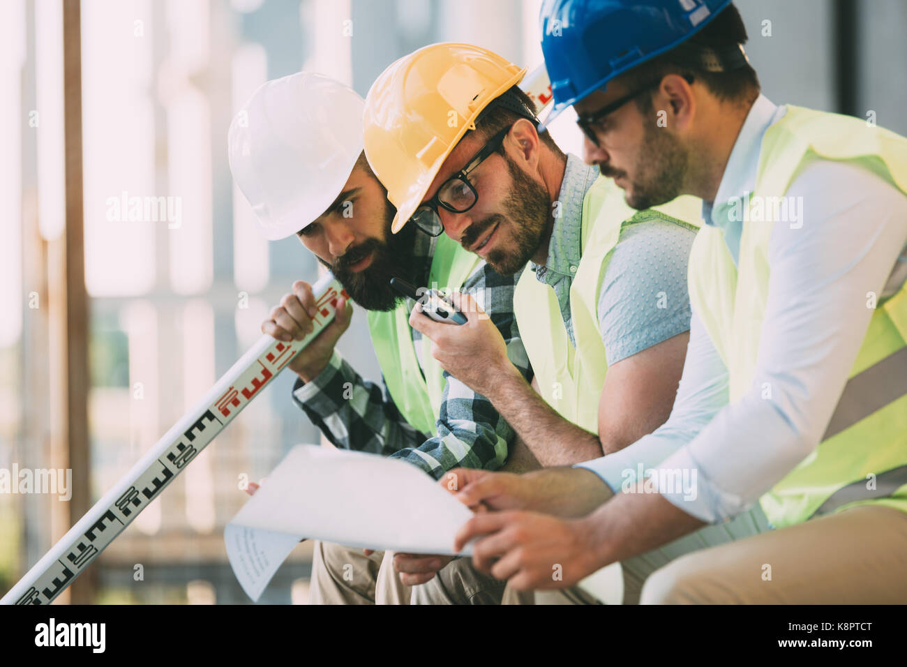 Portrait of construction engineers working on building site Stock Photo ...