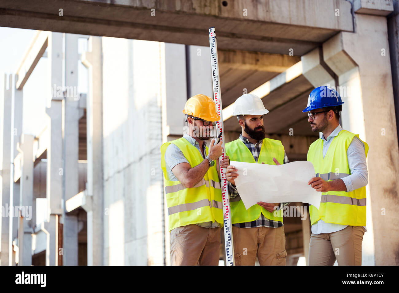 Portrait of construction engineers working on building site Stock Photo ...
