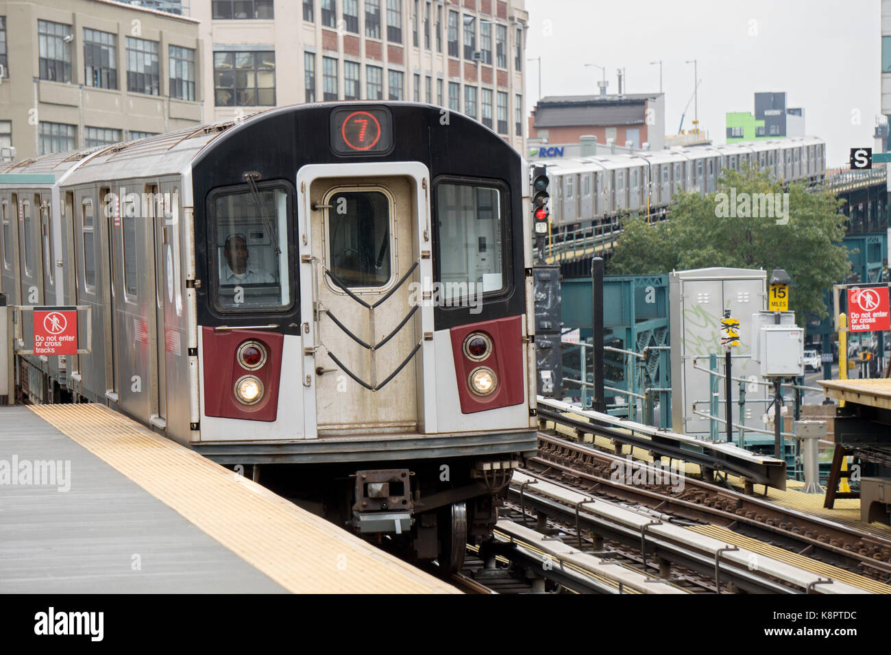 The Manhattan bound #7 elevated subway train pulling into the 45th Road ...