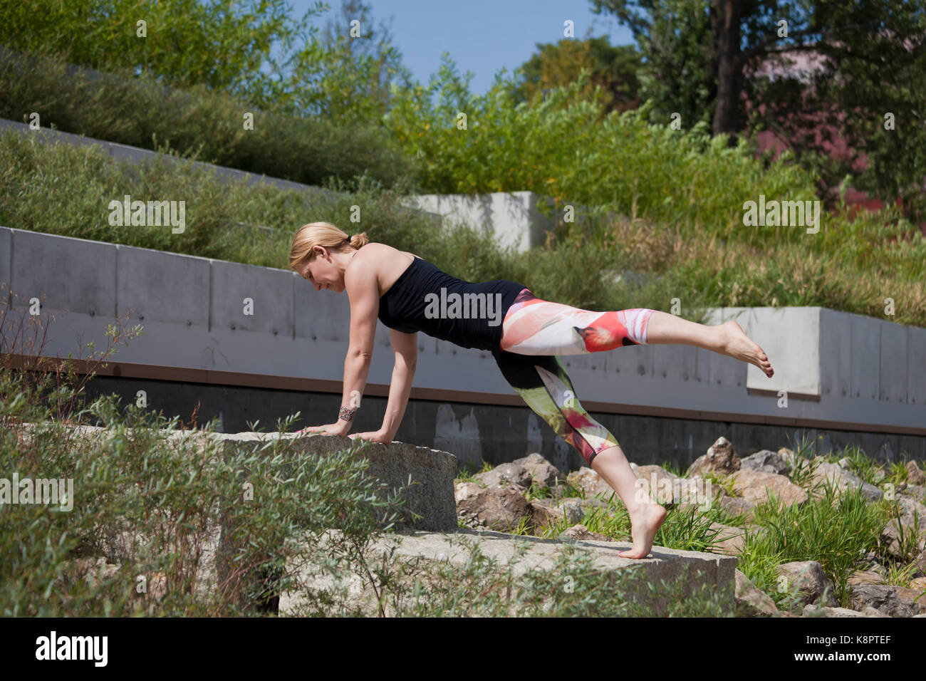 Woman doing outdoor workout in the city Stock Photo - Alamy