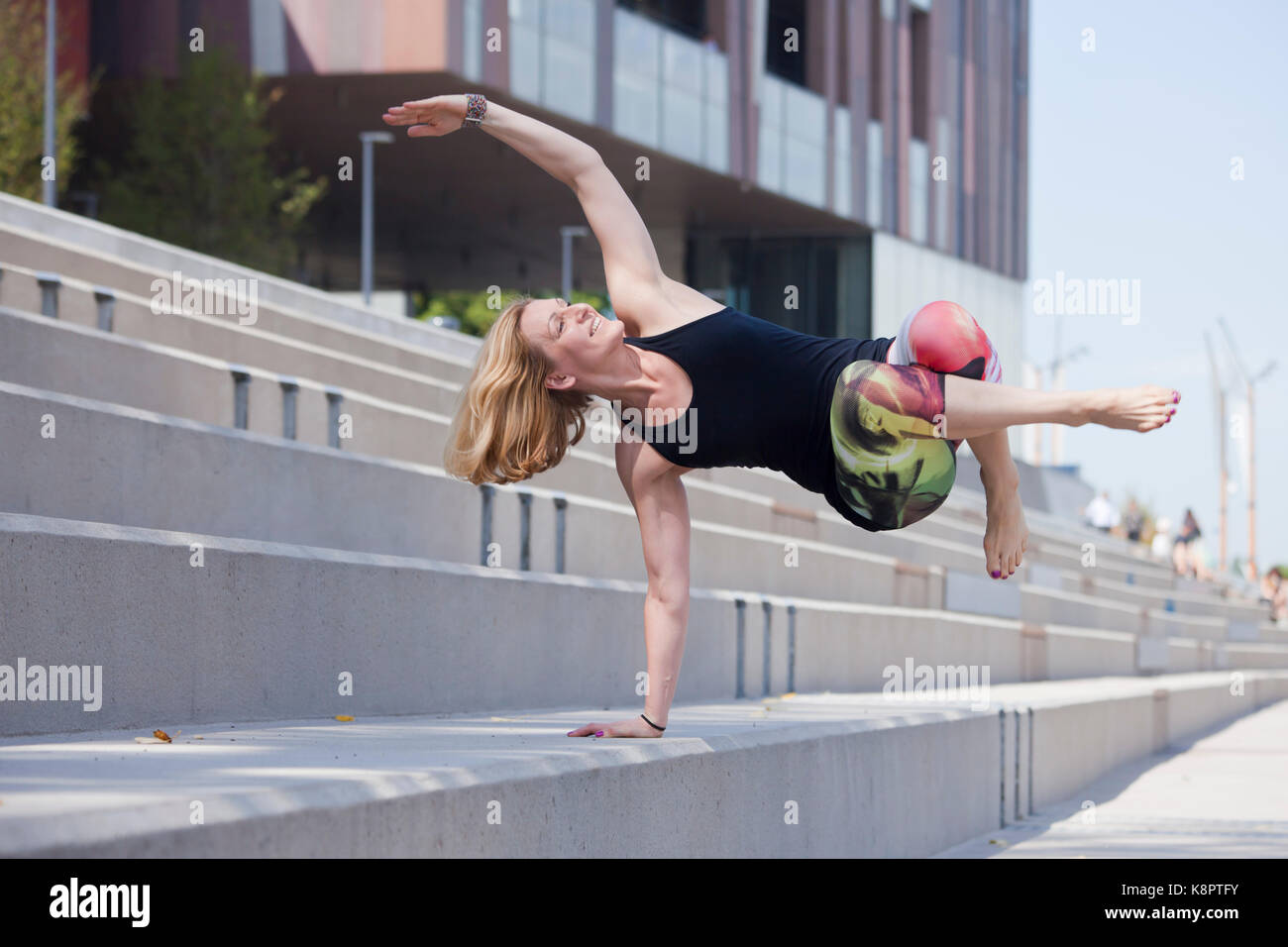 Woman doing outdoor workout in the city Stock Photo - Alamy