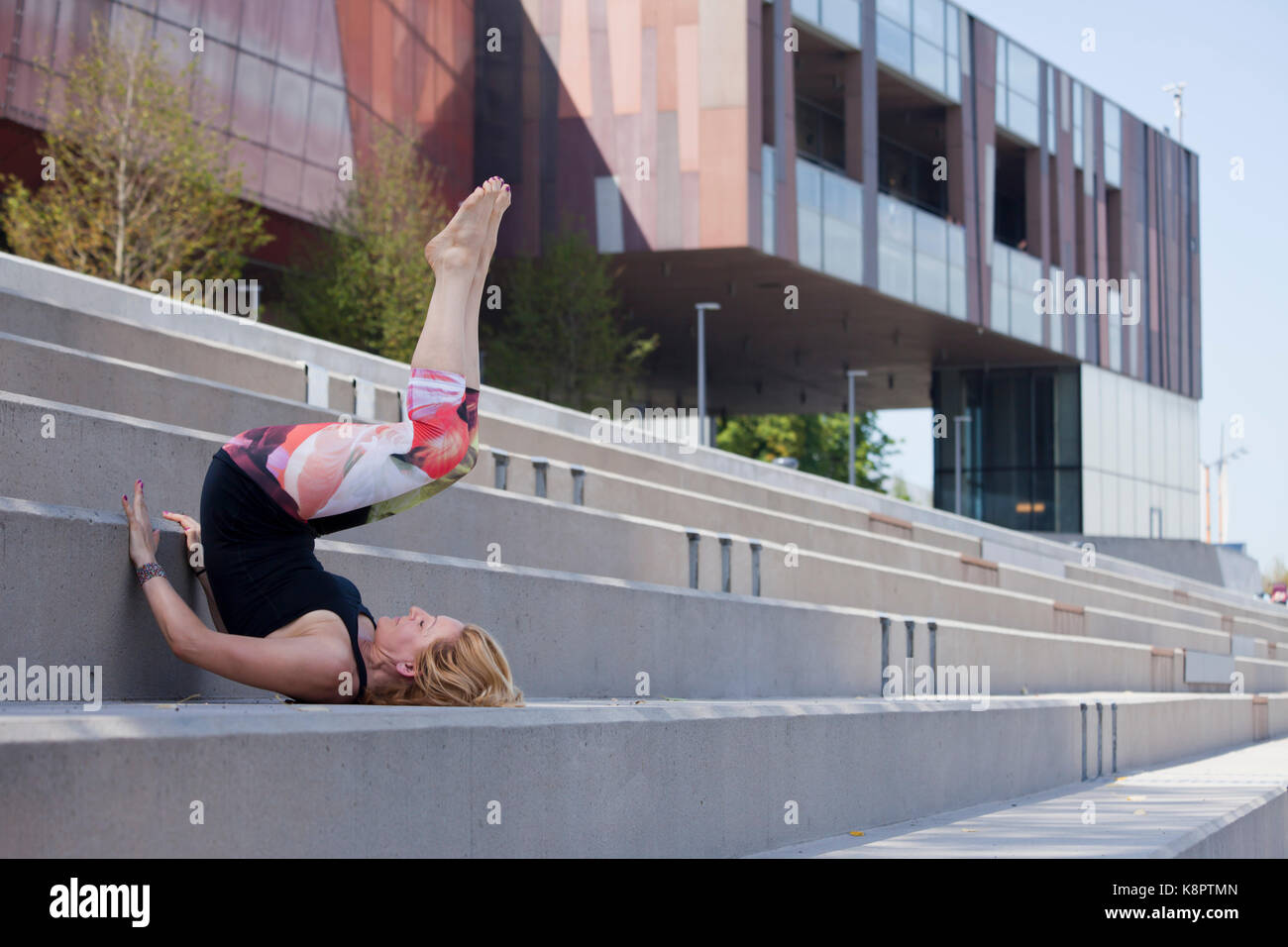 Woman doing outdoor workout in the city Stock Photo - Alamy