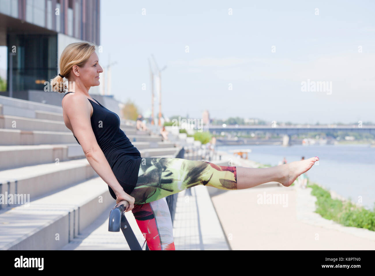 Woman doing outdoor workout in the city Stock Photo - Alamy