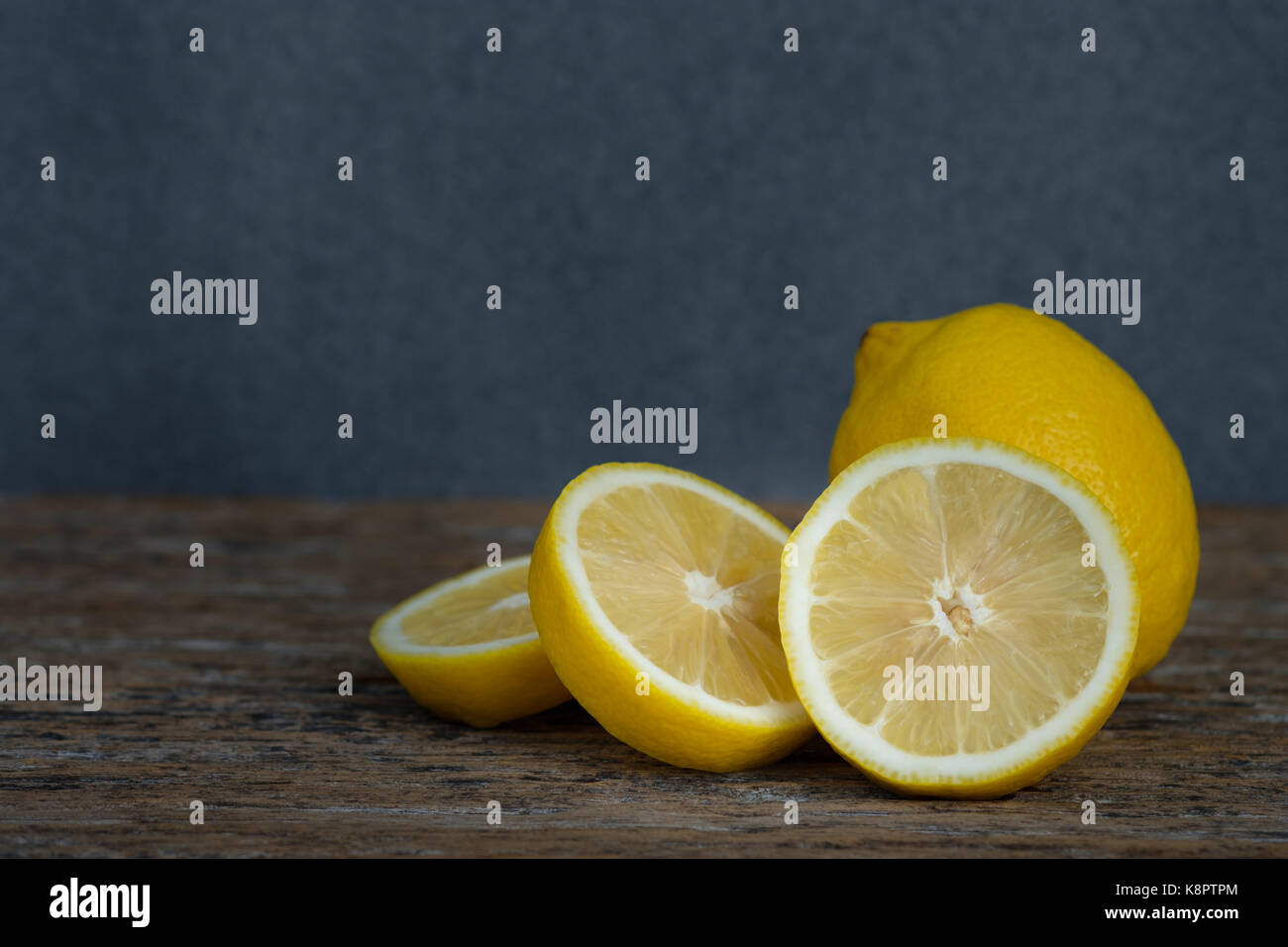 Still life with lemons on rustic low key background, Choose focal point ...
