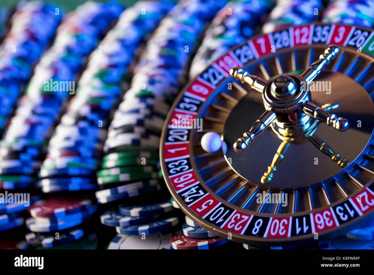 Casino theme. Roulette and stacks of chips Stock Photo - Alamy