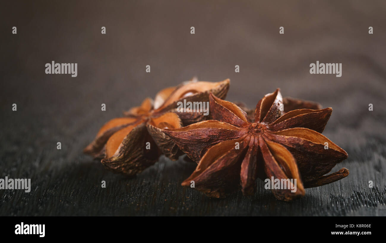 anise stars on old oak table Stock Photo - Alamy