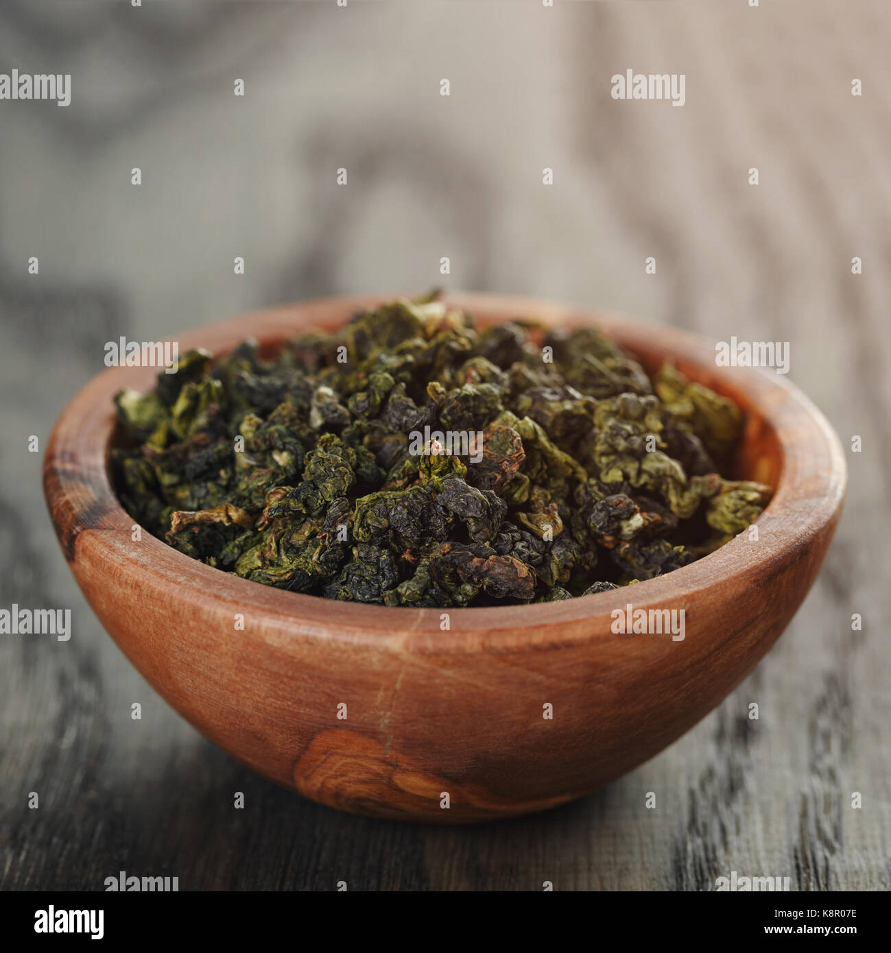 oolong green tea in olive bowl Stock Photo - Alamy