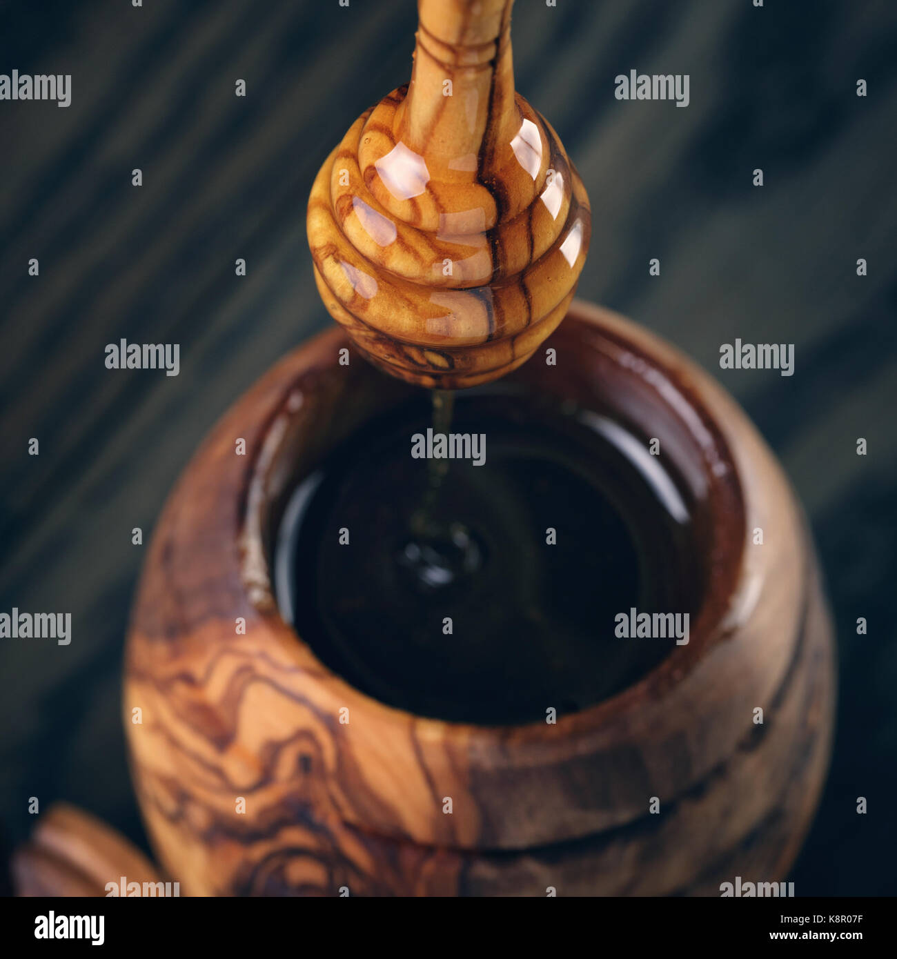 maple honey flowing from dipper to pot Stock Photo - Alamy