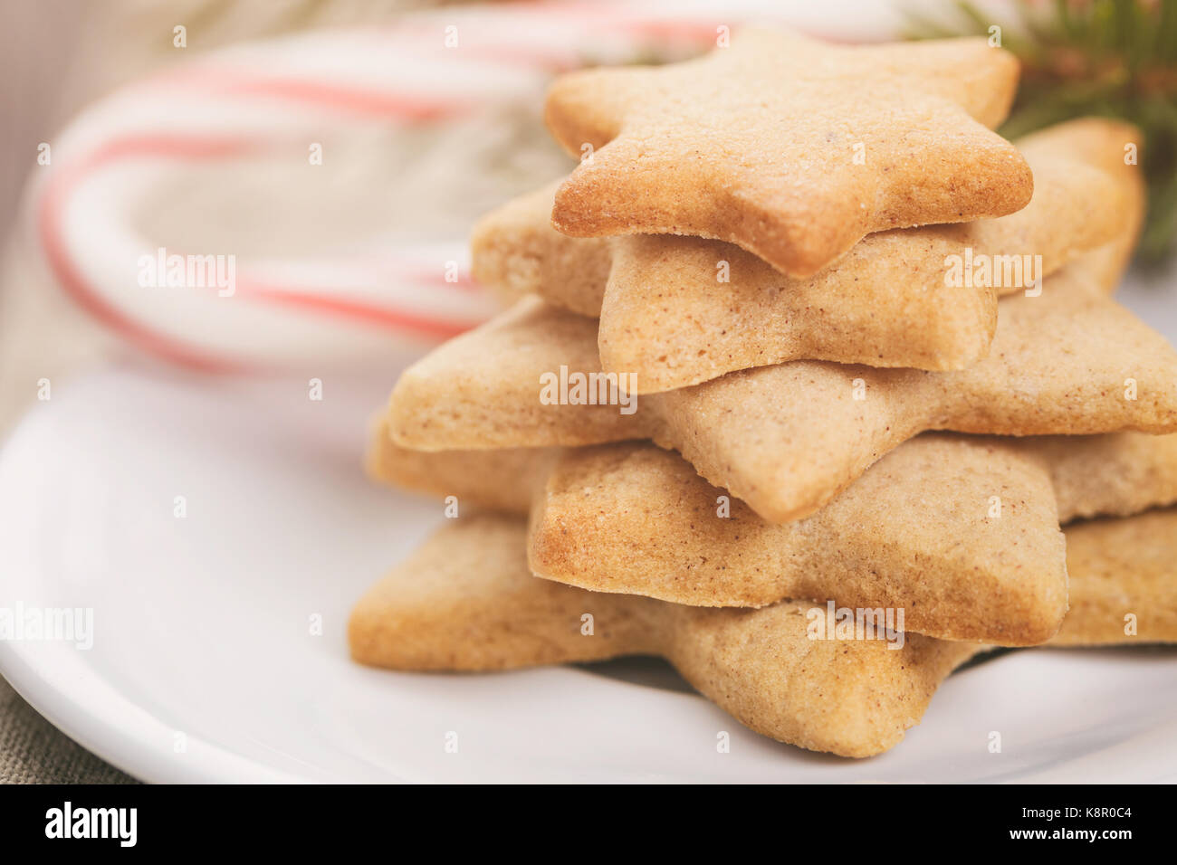 star cookies and candy cane on table Stock Photo - Alamy
