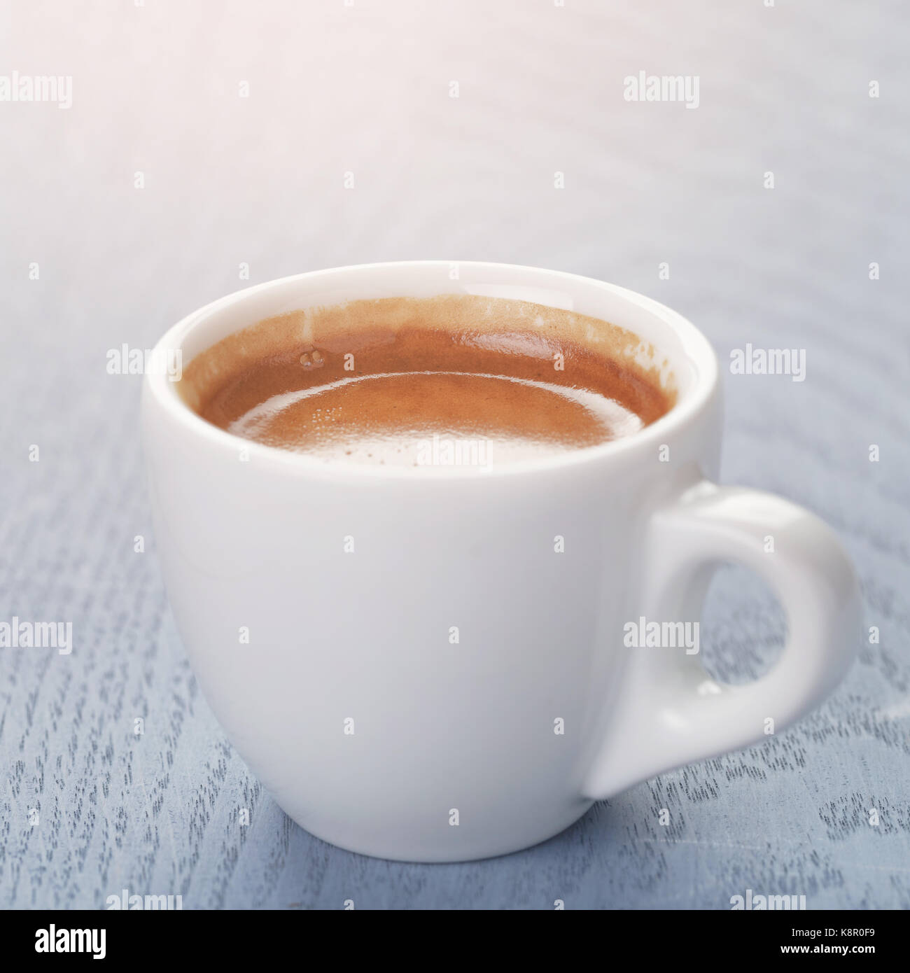 cup of fresh espresso on vintage blue table Stock Photo - Alamy