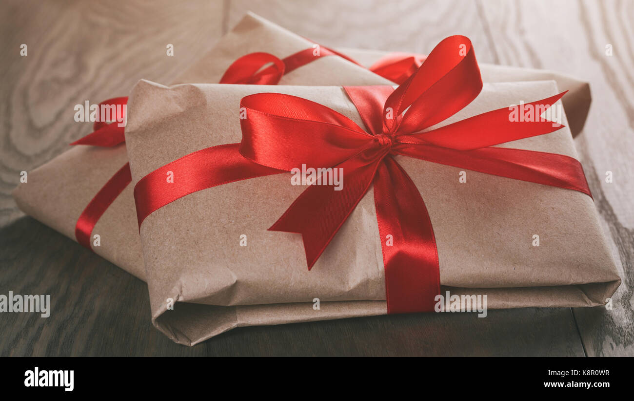 vintage style gifts tied with ribbon and bow Stock Photo - Alamy