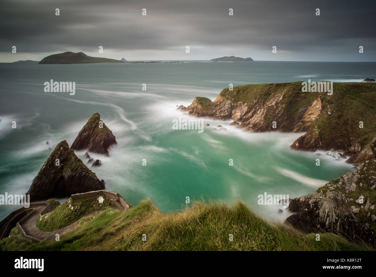 View of winding coastal pathway to pier at dawn, Dunquin Pier, Dingle ...