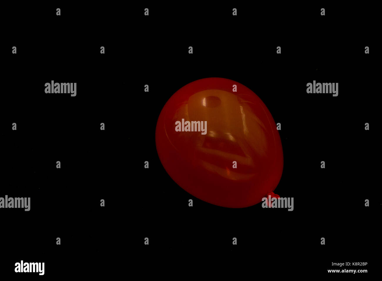 small Balloon on black background Stock Photo - Alamy