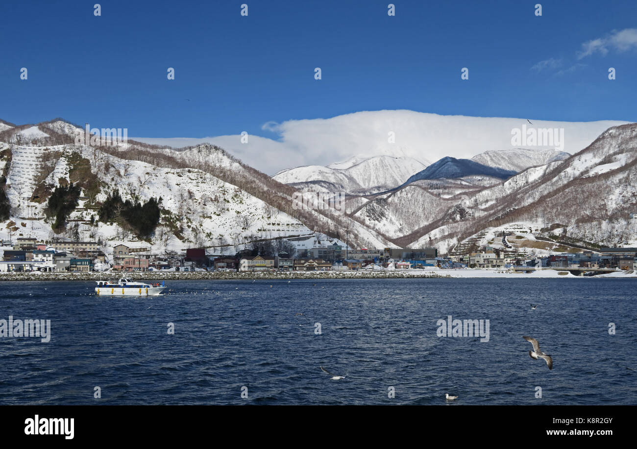 view of town of Rausu from the sea Rausu, Hokkaido, Japan March Stock ...