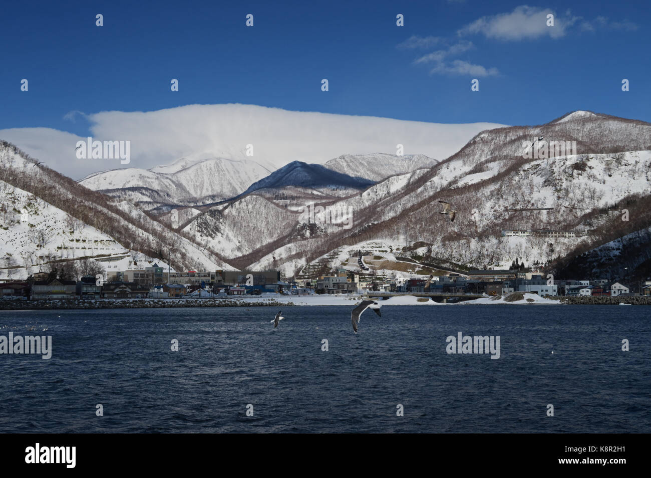 view of town of Rausu from the sea Rausu, Hokkaido, Japan March Stock ...