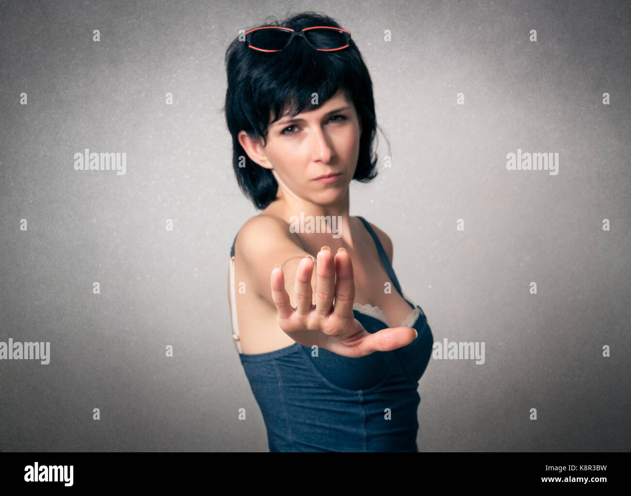 Woman making stop sign Stock Photo - Alamy