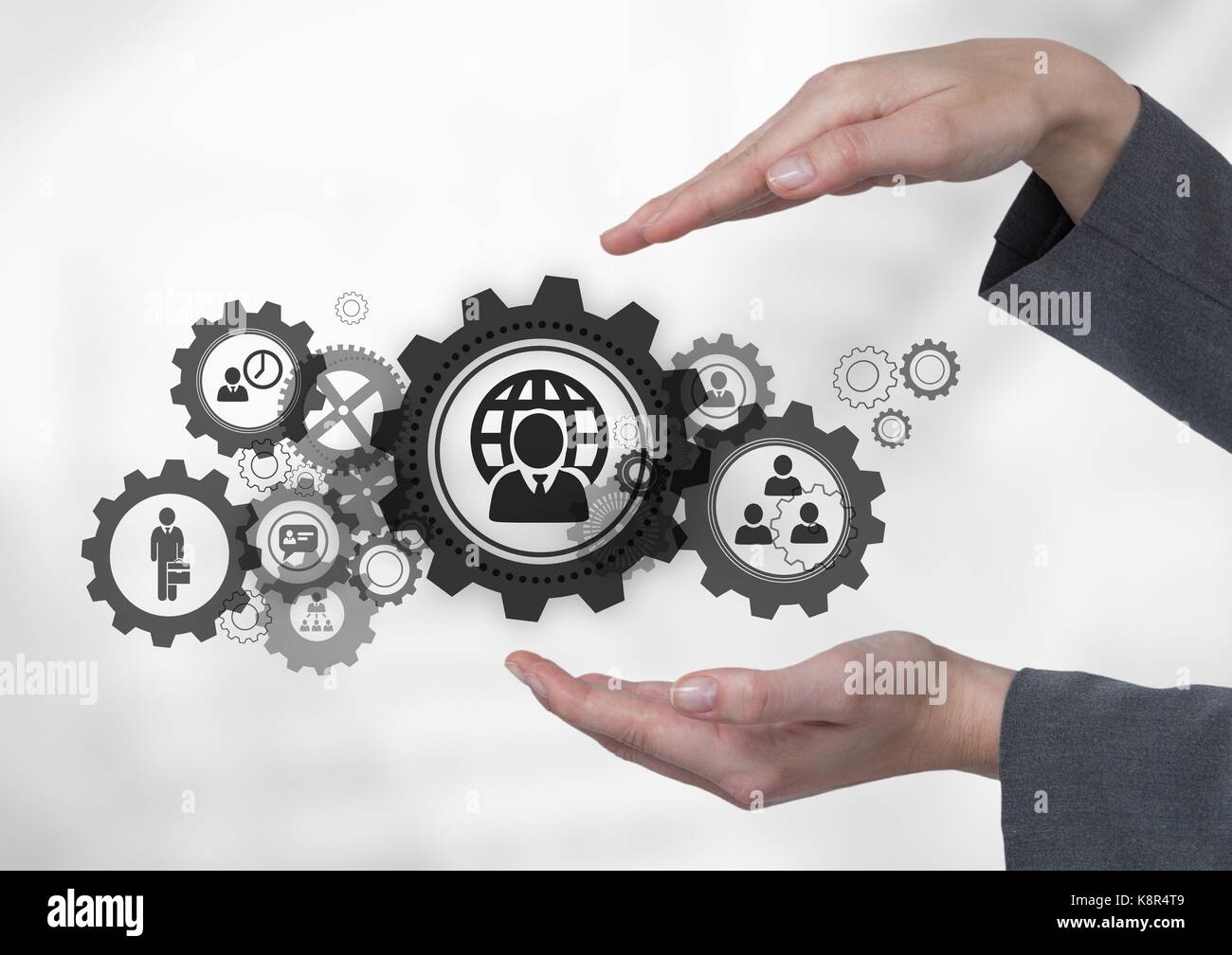 Digital composite of Business woman interacting with people in cogs ...