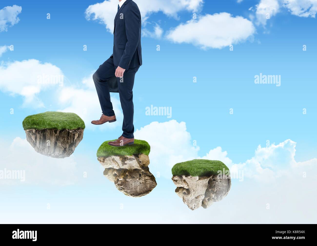 Digital composite of Businessman walking up steps of floating rock ...
