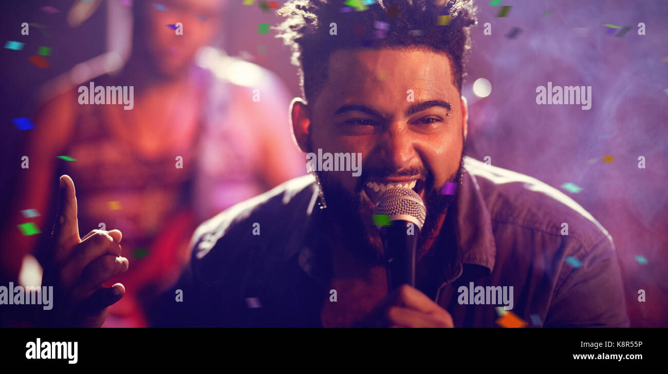 Flying colours against singer performing on stage at nightclub Stock ...