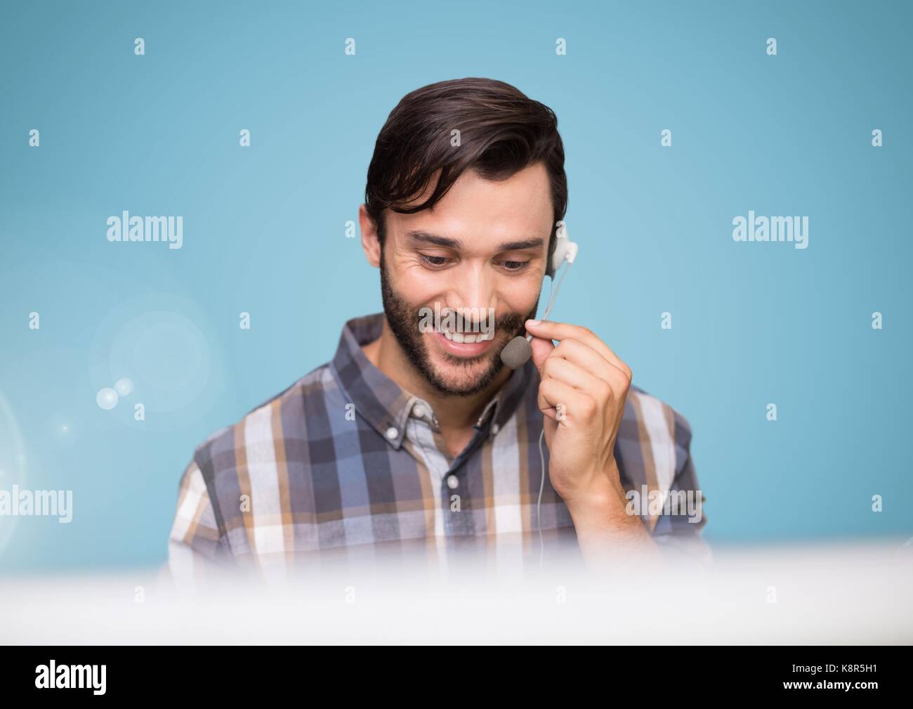 Digital composite of Customer care service man with blue background ...